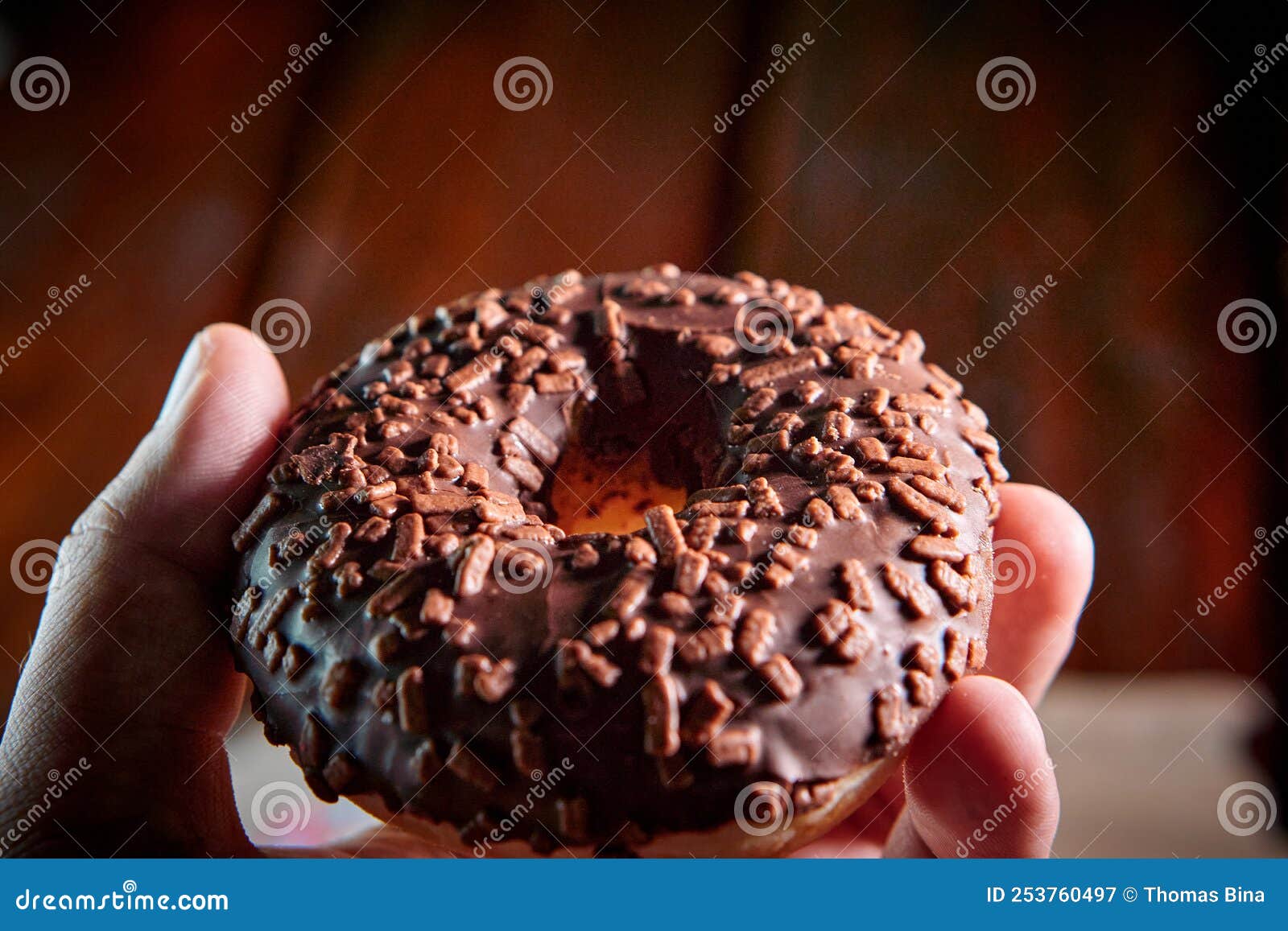 Close-up of a Chocolate Donut in a Human Hand Stock Image - Image of ...