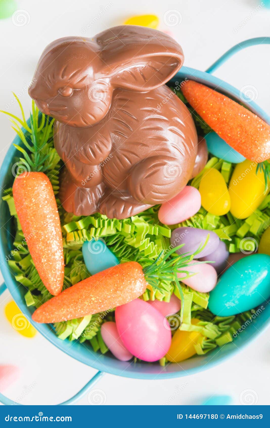 Close-up of Chocolate Easter Bunny in Easter Basket with Mini Carrots ...