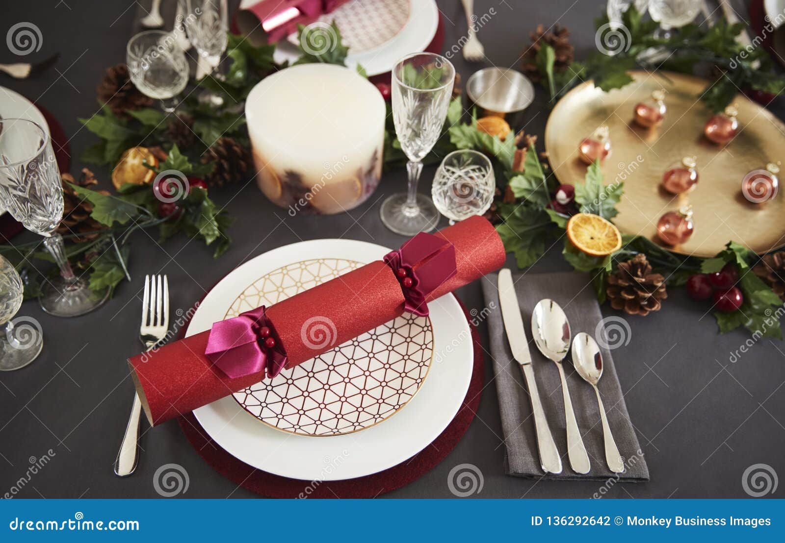 Close Up of Christmas Table Setting with Christmas Crackers Arranged on ...