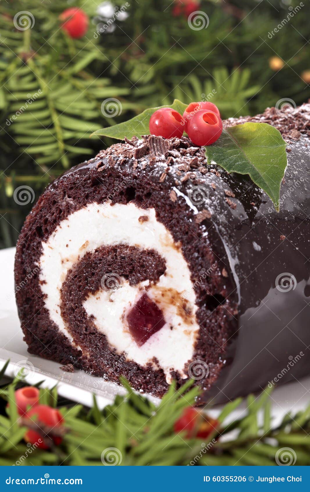Close Up of Christmas Yule Log Cake on Plate Under Tree Stock Photo ...