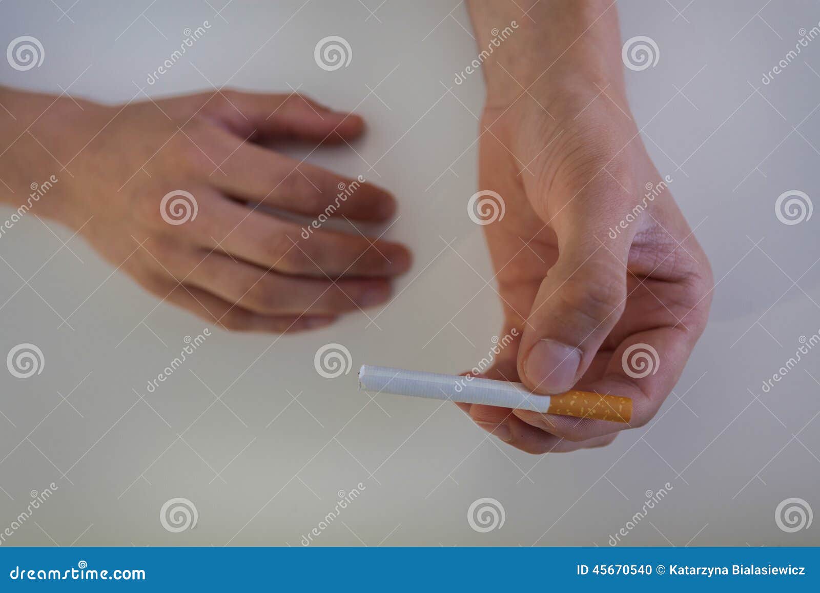 Close-up of a Cigarette Held in the Hands Stock Photo - Image of ...
