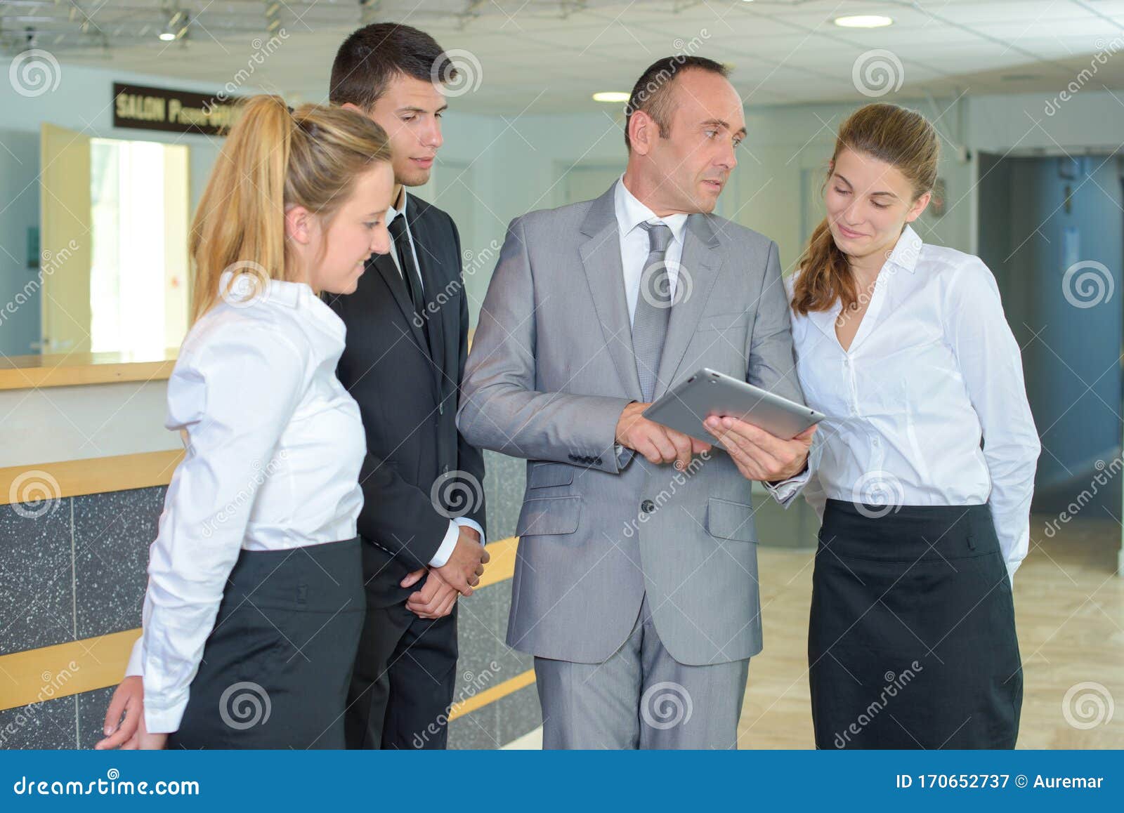 Close Up Cleaners and Manager in Hotel Lobby Stock Image - Image of ...