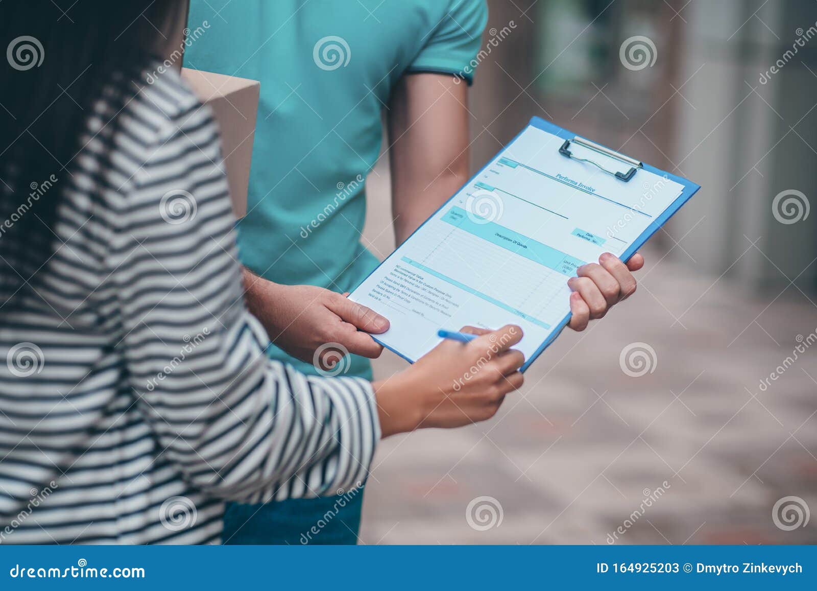 Close Up of Client Signing Declaration after Receiving Parcel Stock ...