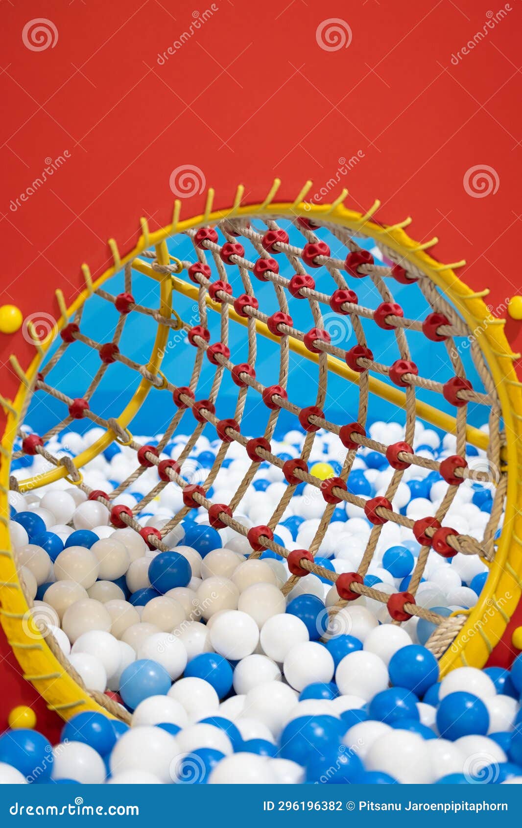 Close-up of a Climbing Net in a Play Park with Small Balls on the Floor ...
