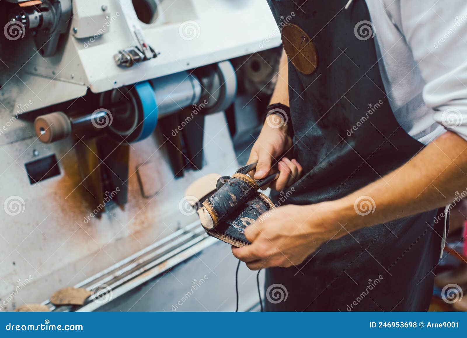 Close-up of Cobbler Working on Pair of Shoes with Machine Stock Photo ...