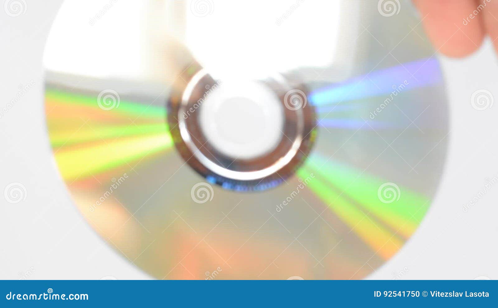 Close Up of Compact Disc. Man Hand Rotate with CD Rom Infront of Camera ...
