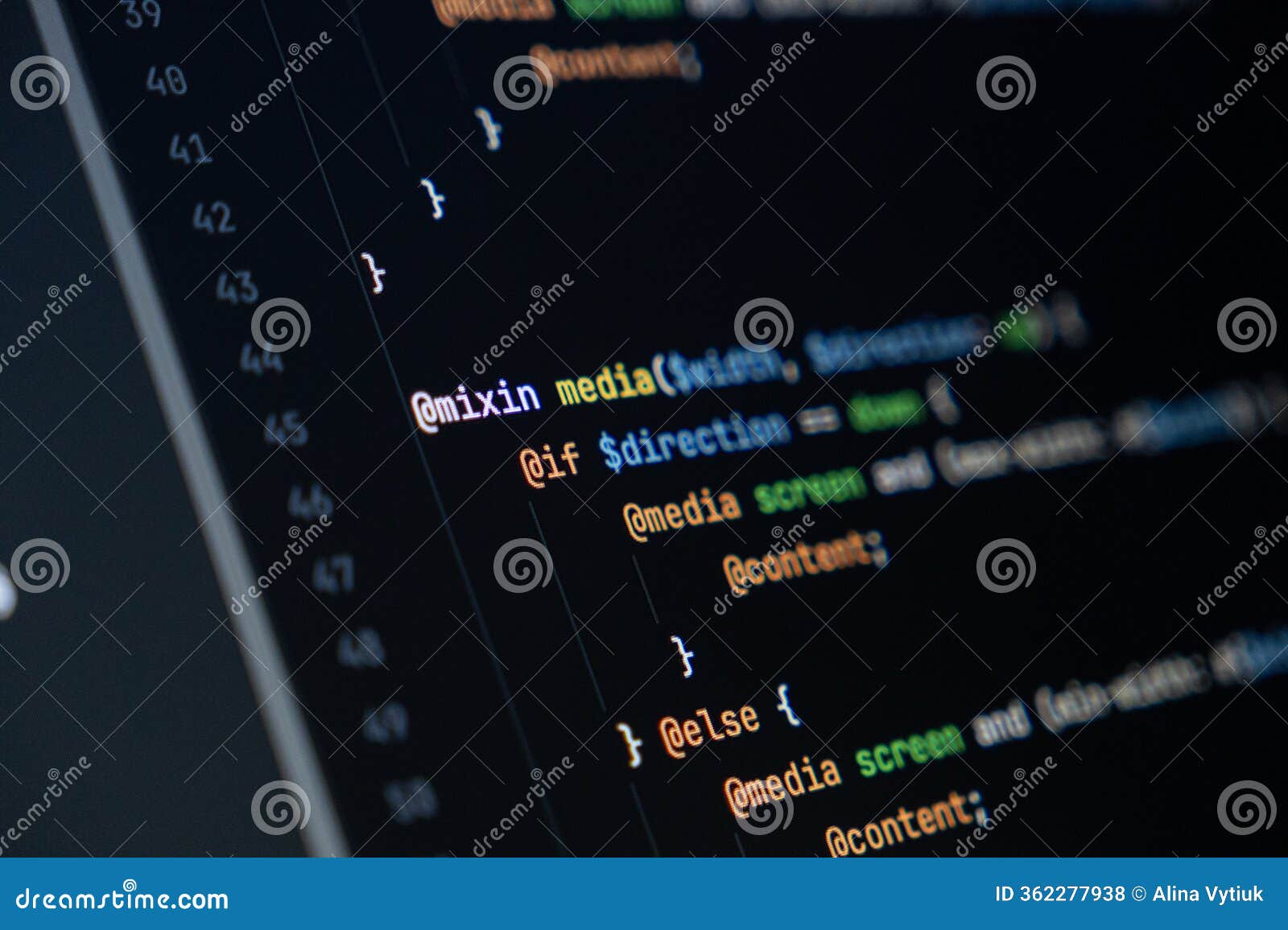 Close-up of Computer Screen with Colorful Sass Code, Focus on Mixin and ...