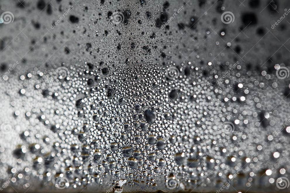 CLose Up of Condensation Bubbles and Marks on a Window Water Background ...