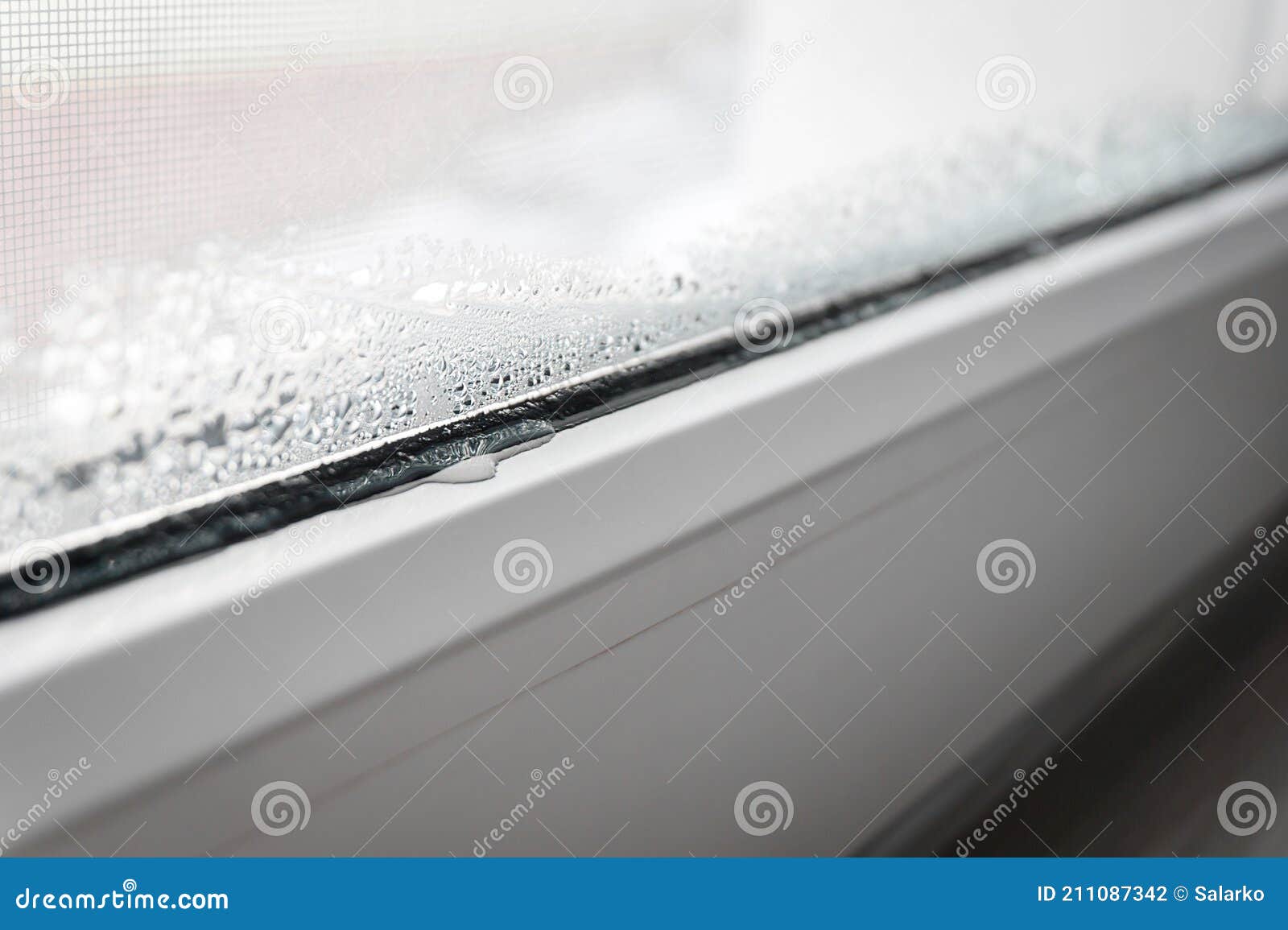 Condensation on PVC window stock photo. Image of buildings - 211087342