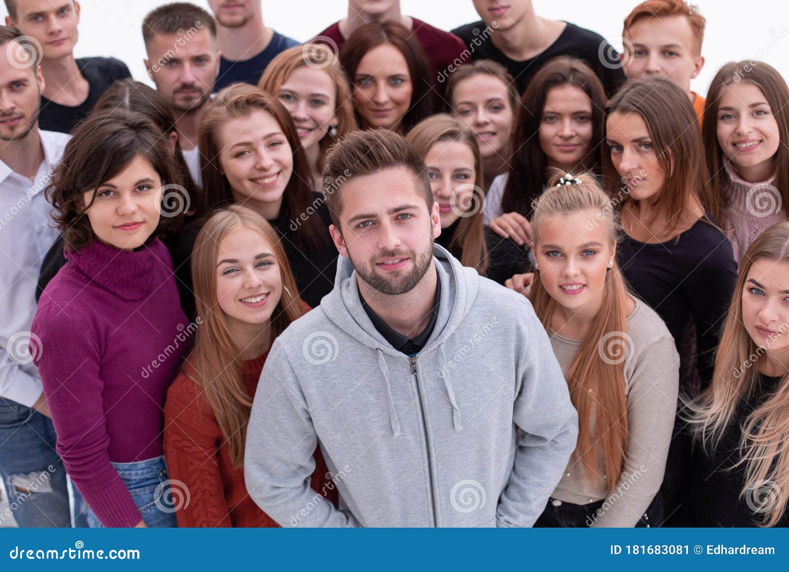 Close Up. Confident Guy Standing among His Friends Stock Image - Image ...