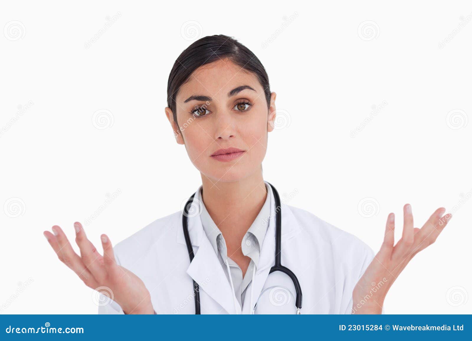 Confused Doctor Pointing Fingers Up, Looking Puzzled, Standing In ...