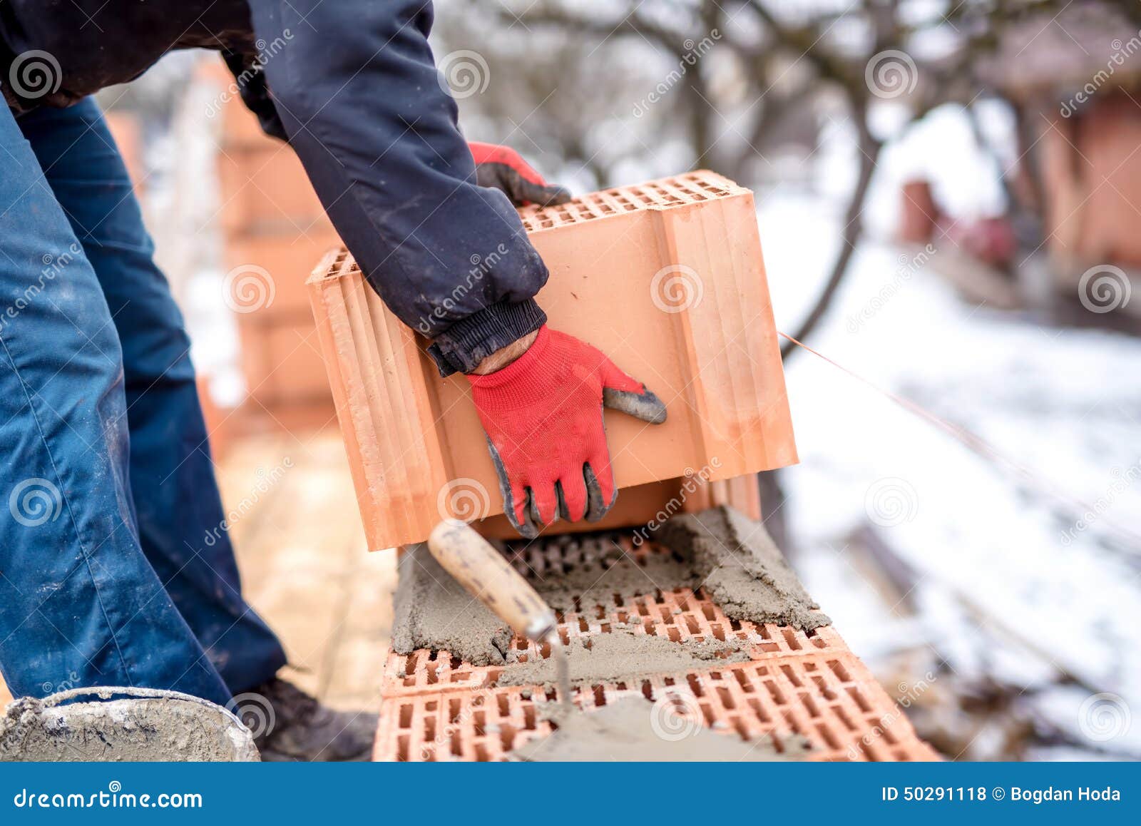 Close-up of Construction Worker, Bricklayer Building New House with ...