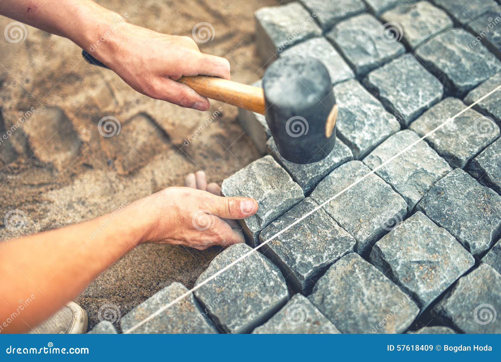 Close-up of Construction Worker Installing and Laying Pavement Stones ...