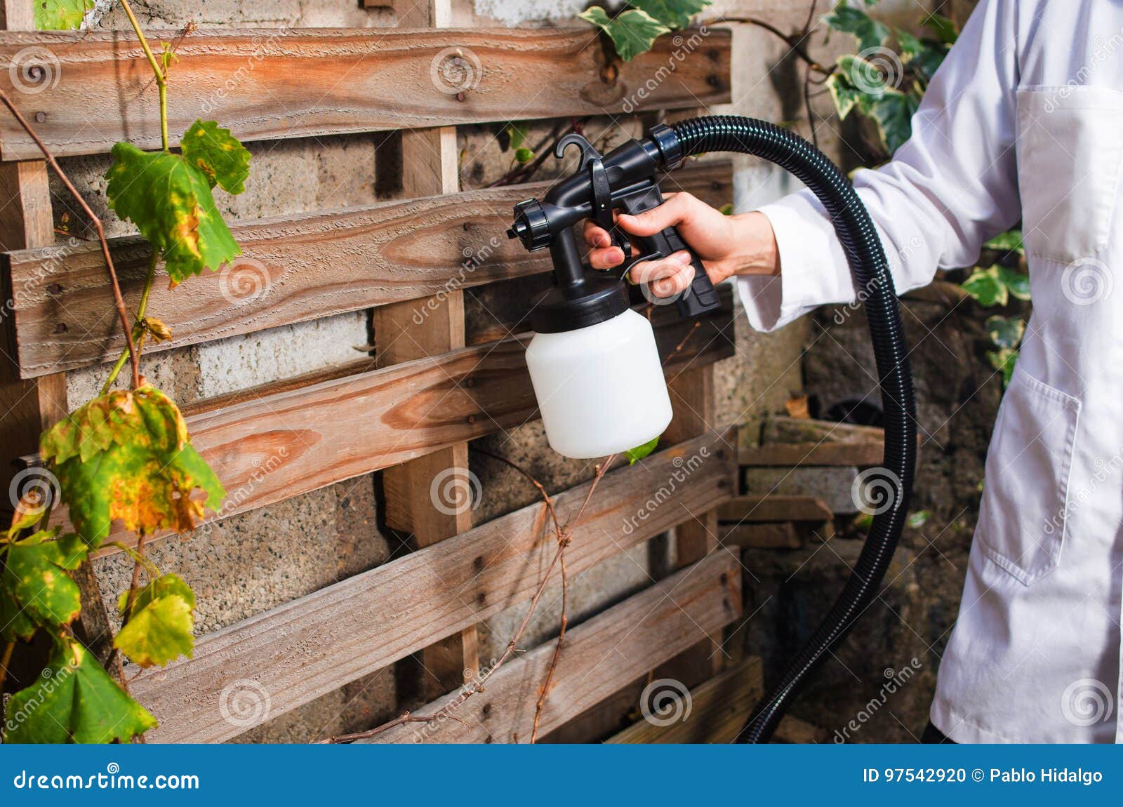 Close Up of a Construction Worker Using the Painting Spray Gun in ...