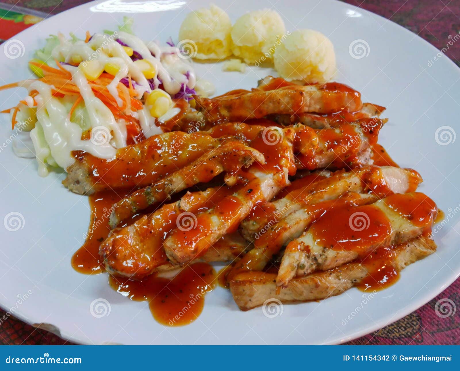 Cooked and Sliced Chicken Stakes Served Along with Vegetable Salad and ...
