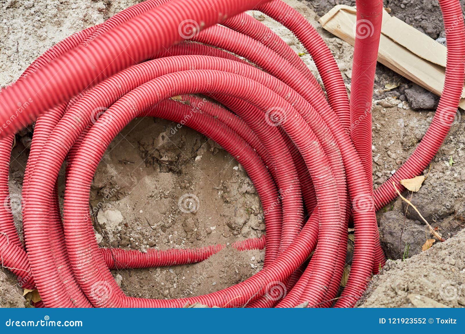 Close Up of Corrugated Red Drain Pipe Lays on the Ground. Stock Photo ...