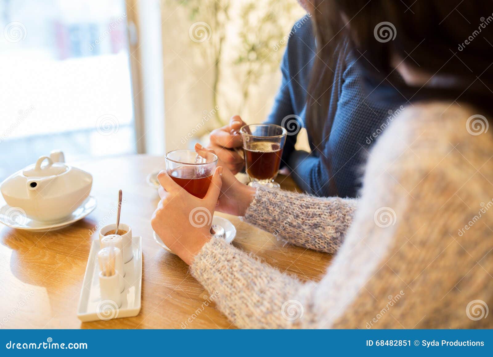 Close Up of Couple Drinking Tea at Cafe Stock Image - Image of table ...