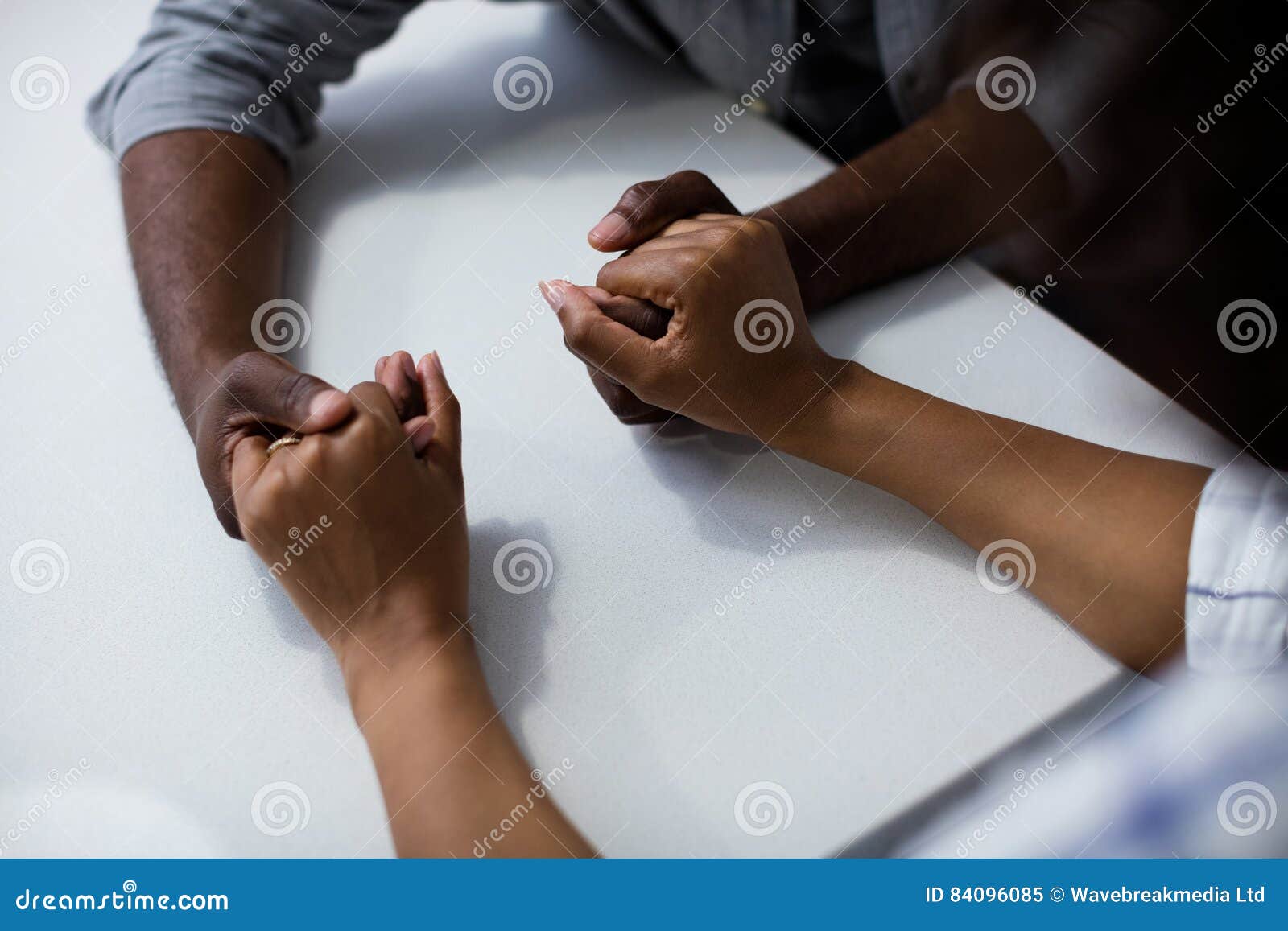 Close-up of Couple Holding Hands on Table in Kitchen Stock Image ...