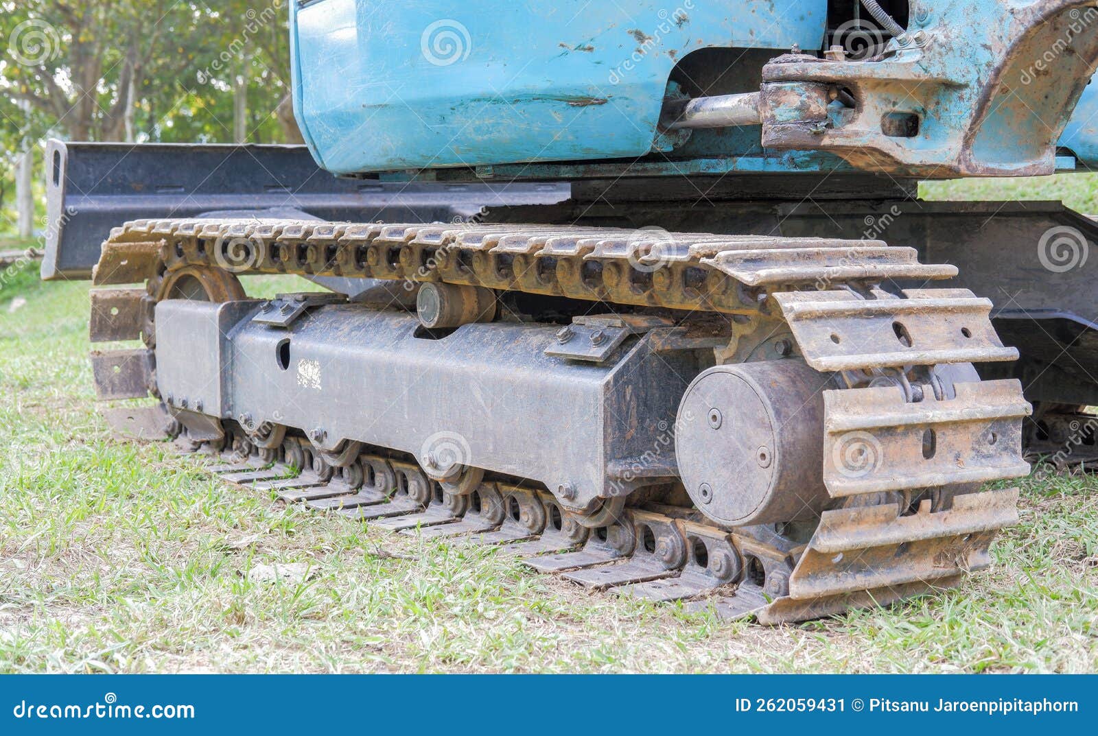 Close Up the Crawler of Backhoe Loader in Side View. on the Lawn Stock ...
