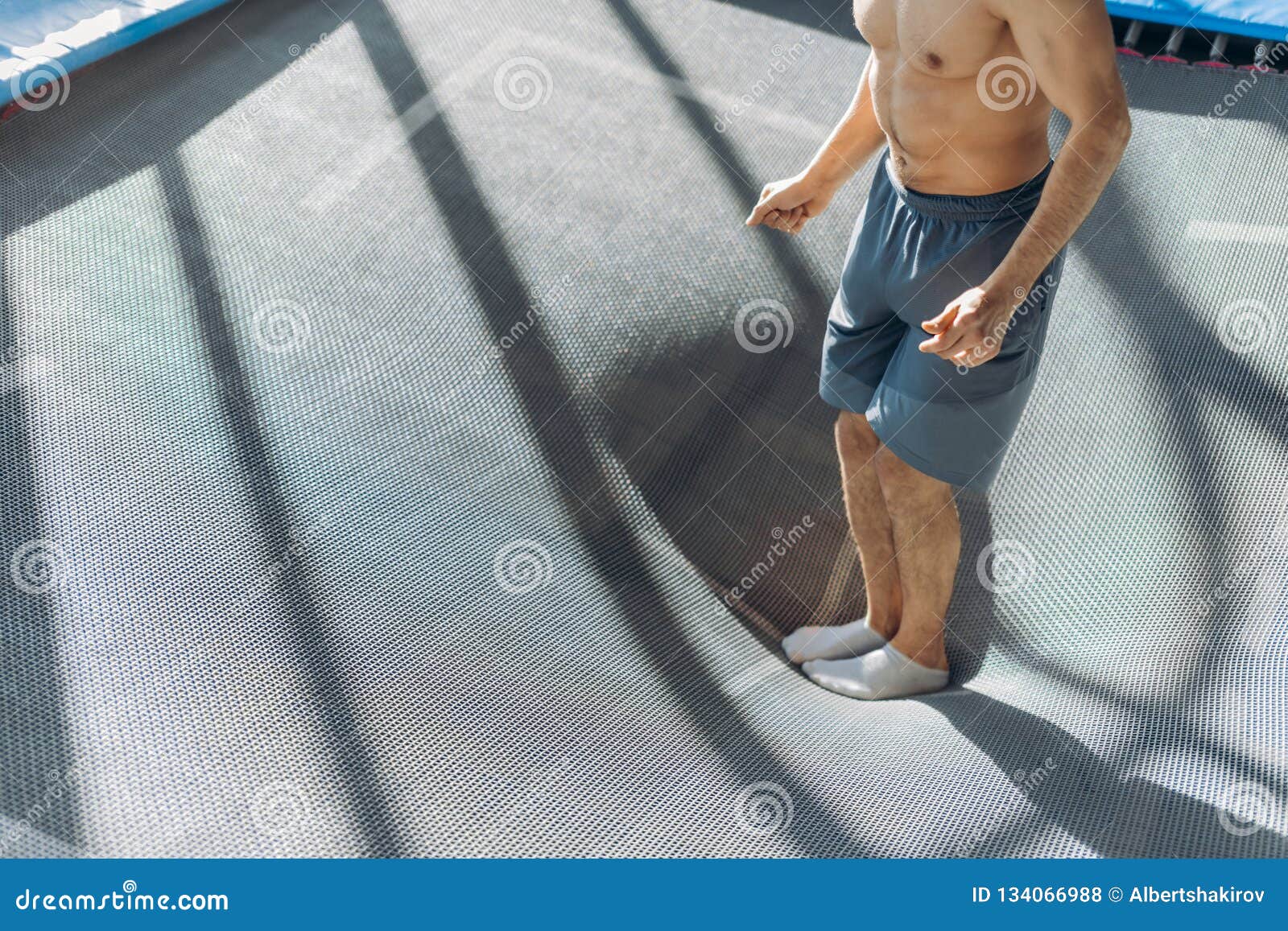 Close Up Cropped Photo. Man is Testing the Trampoline Stock Photo ...