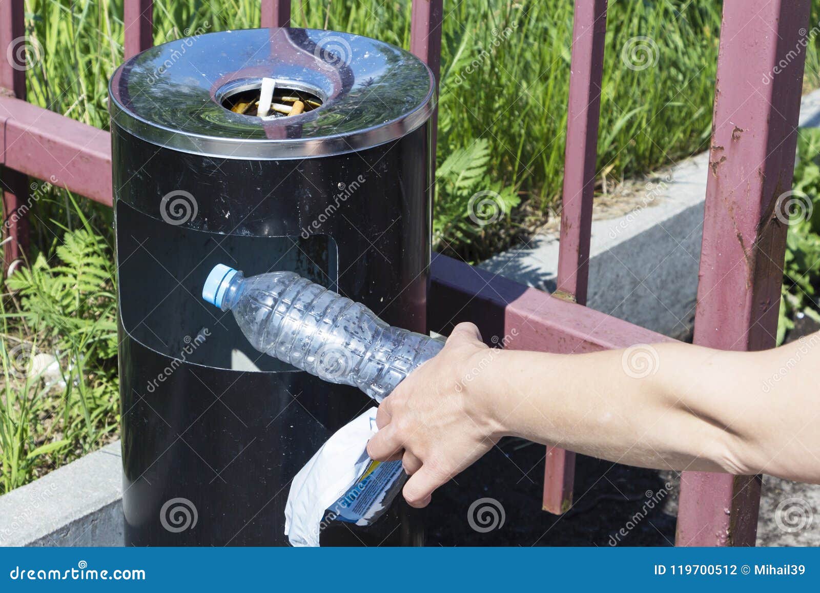 Close - Up of Cropped Portrait of Someone Throwing Trash in the Trash ...