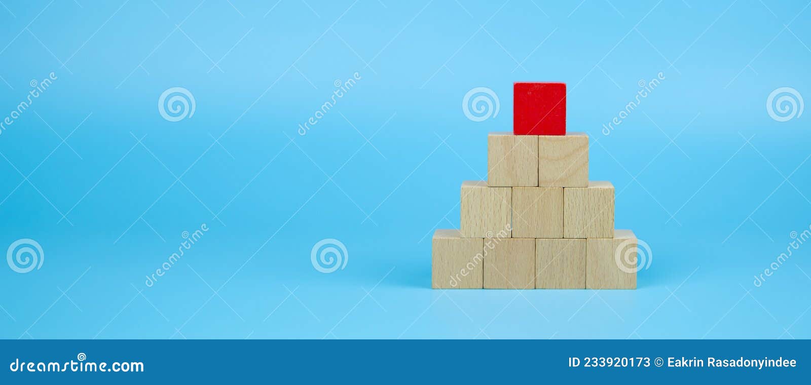 Close-up Cube Wooden Block Toy Stack in Pyramid on Blue Background ...