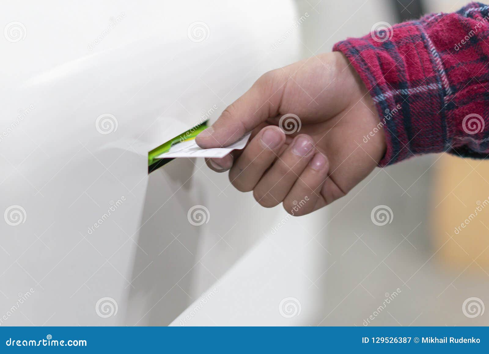 Close Up Customer Hand Pull a Ticket Number from Dispenser Machine To ...