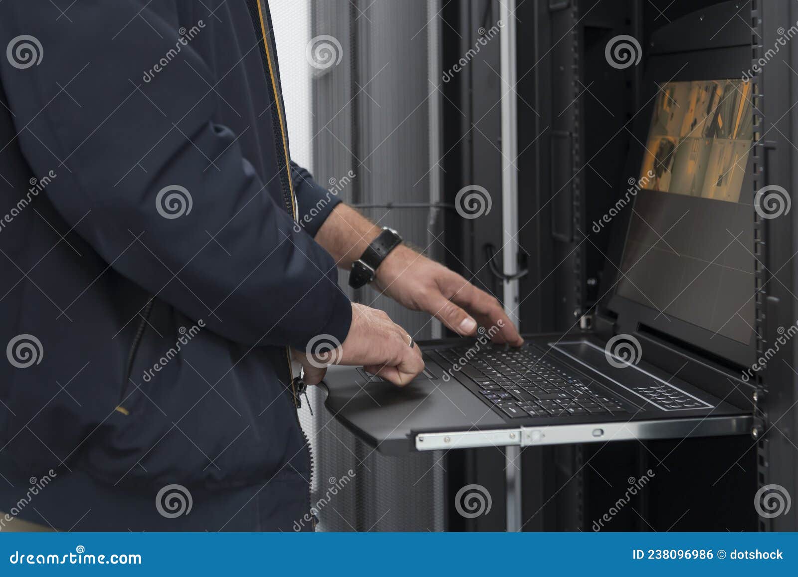 Close Up on Data Center Engineer Hands Using Keyboard on a ...