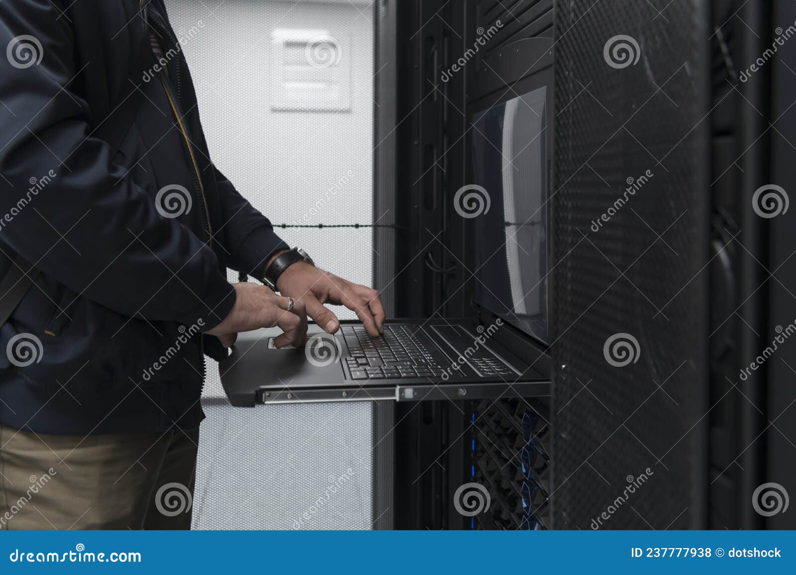 Close Up on Data Center Engineer Hands Using Keyboard on a ...