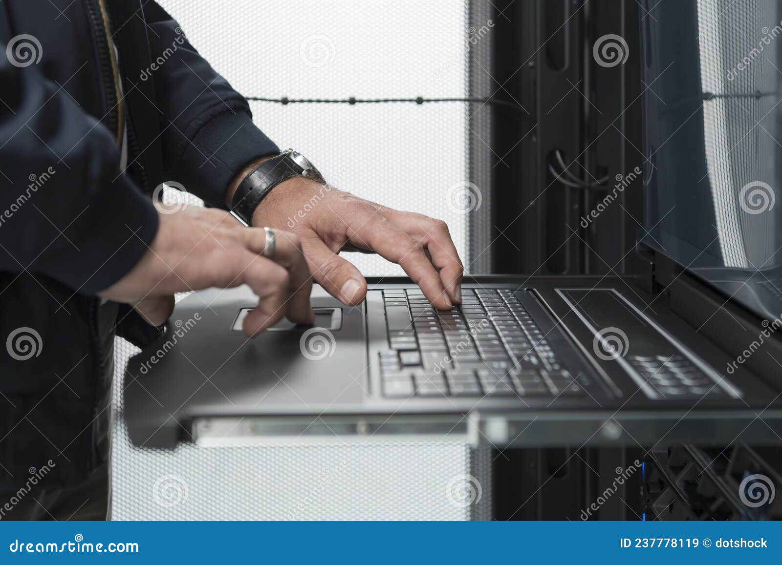 Close Up on Data Center Engineer Hands Using Keyboard on a ...