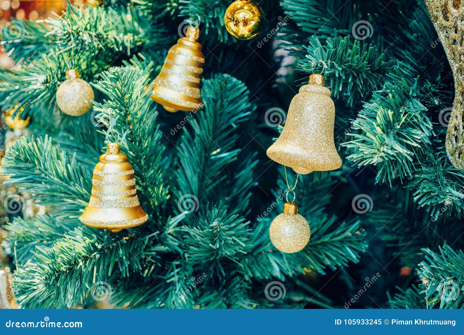 Decorated Golden Bell on Christmas Tree Stock Image - Image of bright ...