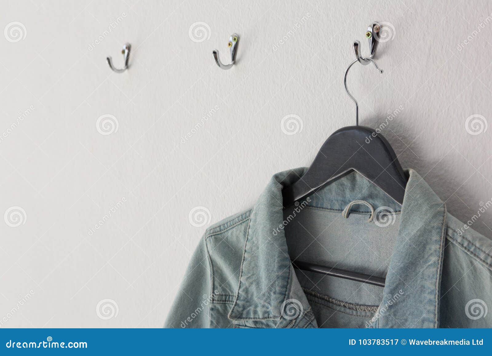 Denim Jacket Hanging on Hook Stock Image - Image of protection, wall ...