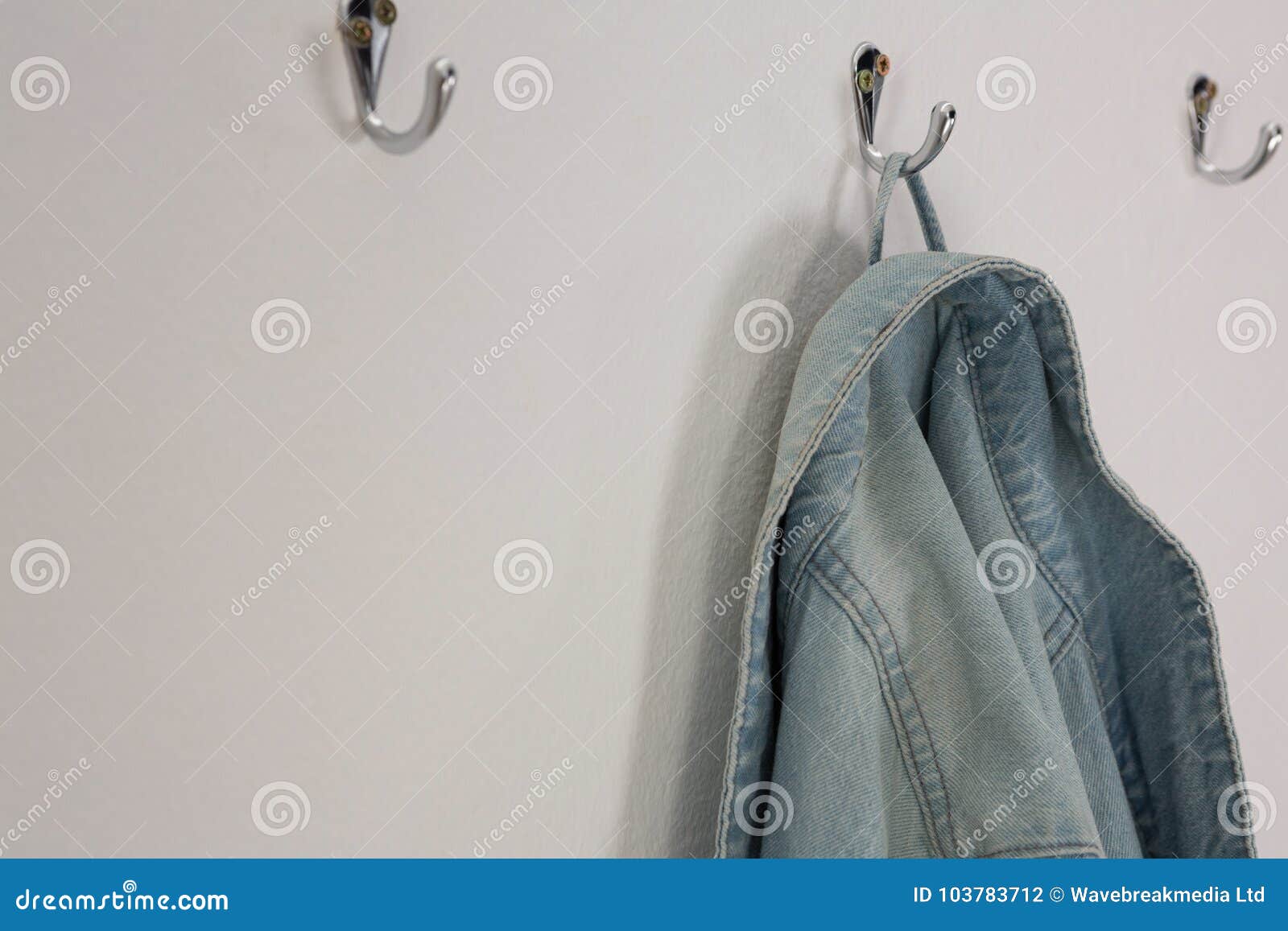 Denim Jacket Hanging on Hook Stock Photo - Image of people, hook: 103783712