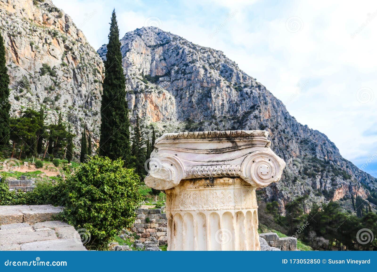 Close-up Detail of Broken Ionic Column in Front of Blurred Rocky ...