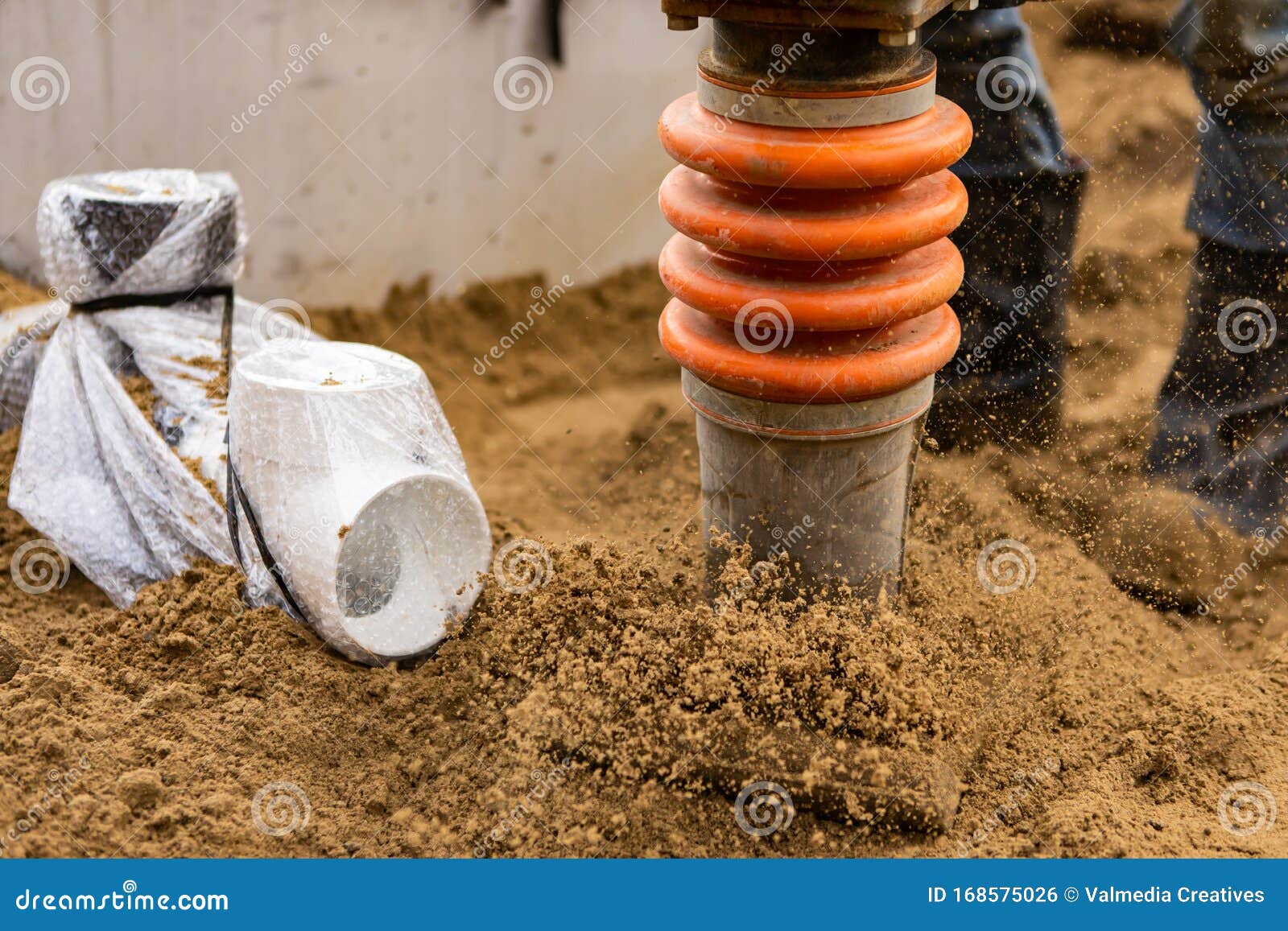 Vibratory Hydraulic Earth Rammer at Work Stock Photo - Image of labor ...