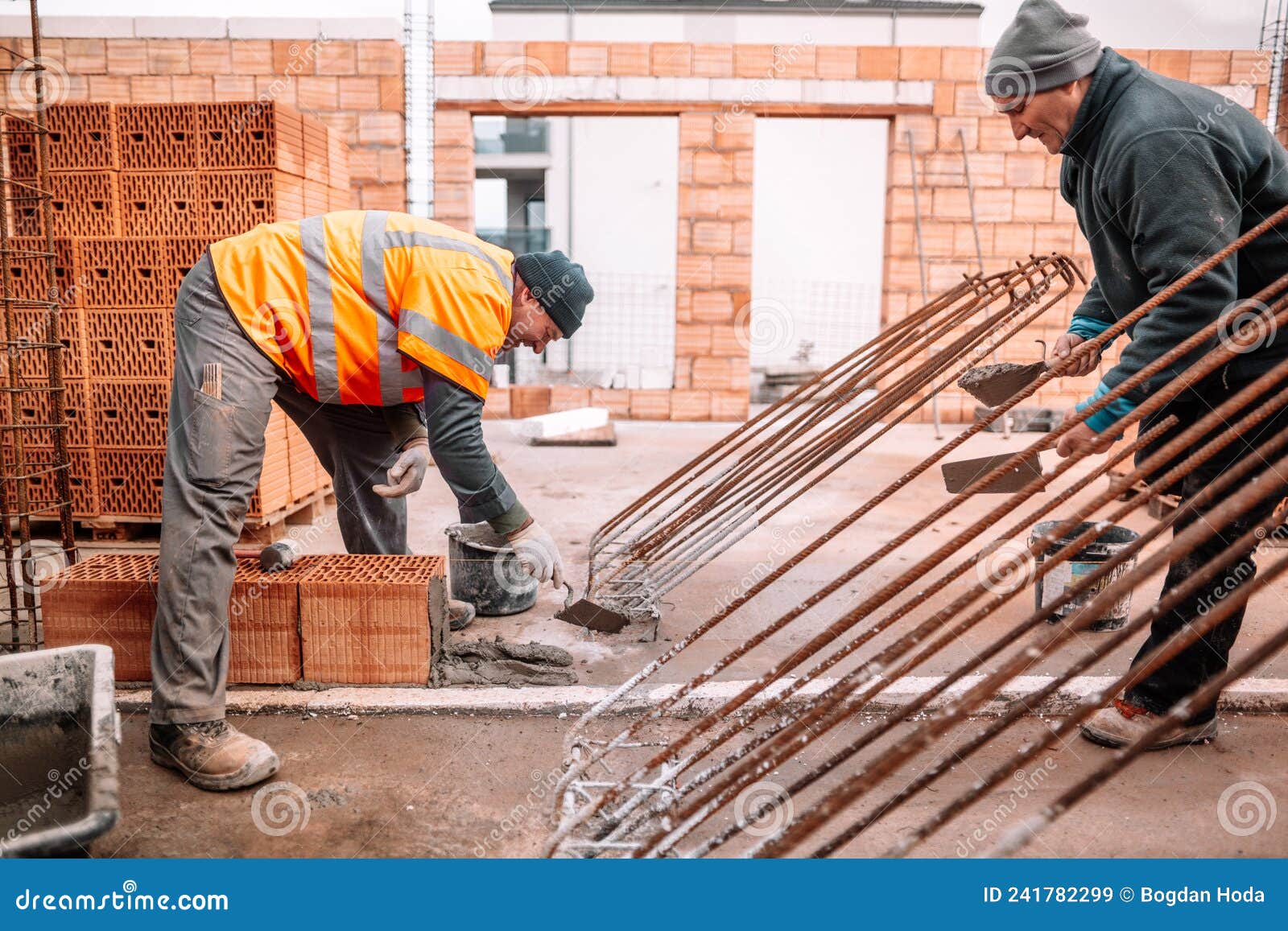 Close Up Details of Masons Working with Bricks, Mortar, Cement and ...