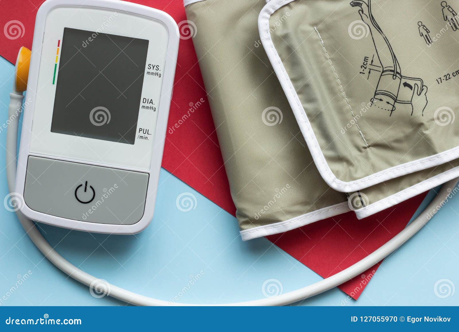 Close-up, a Device for Measuring Blood Pressure on a Blue and Red ... Close-up, a Device for Measuring Blood Pressure on a Blue and Red ...