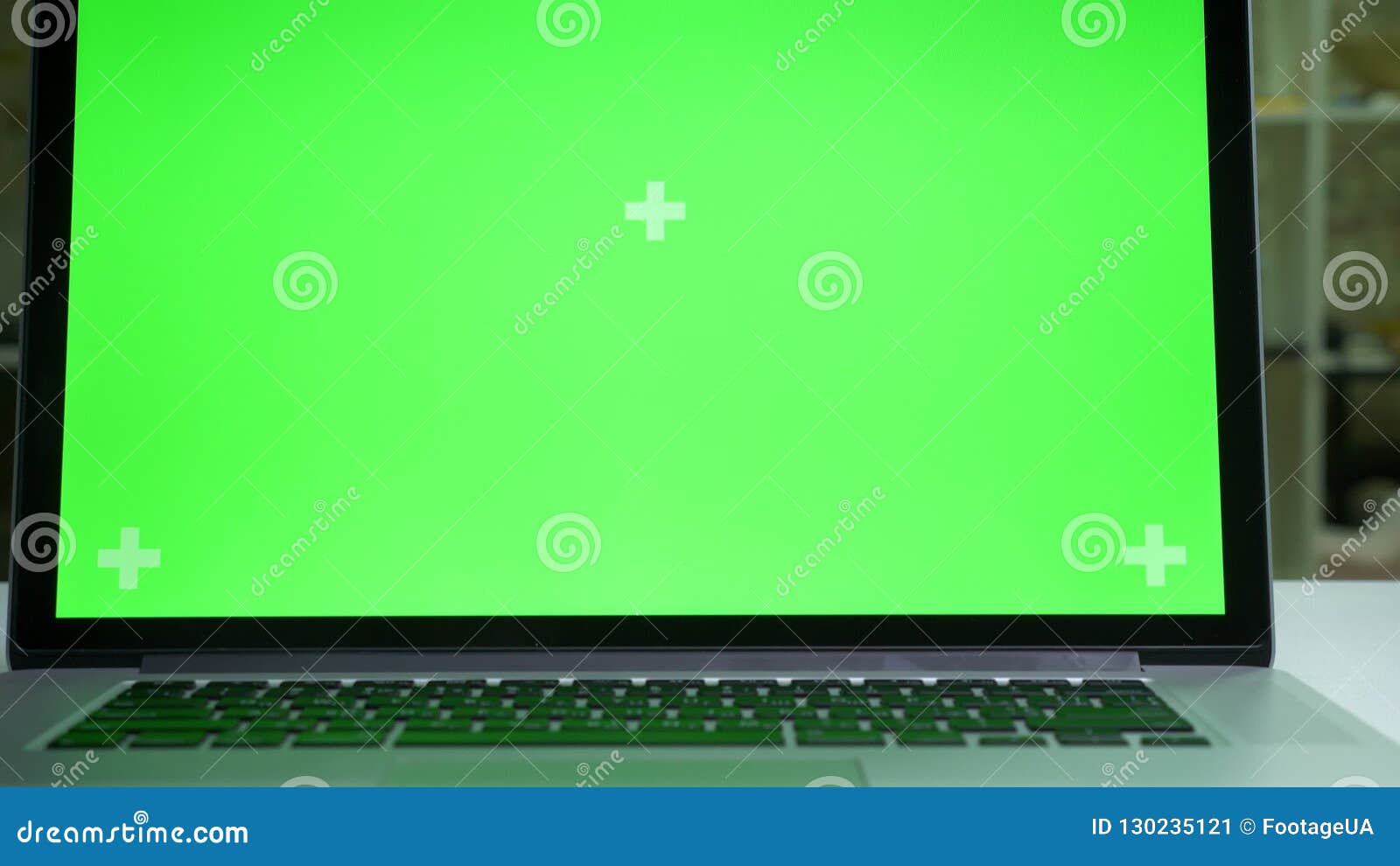 Close-up Device on White Table, Green Screen on the Laptop, Inside ...