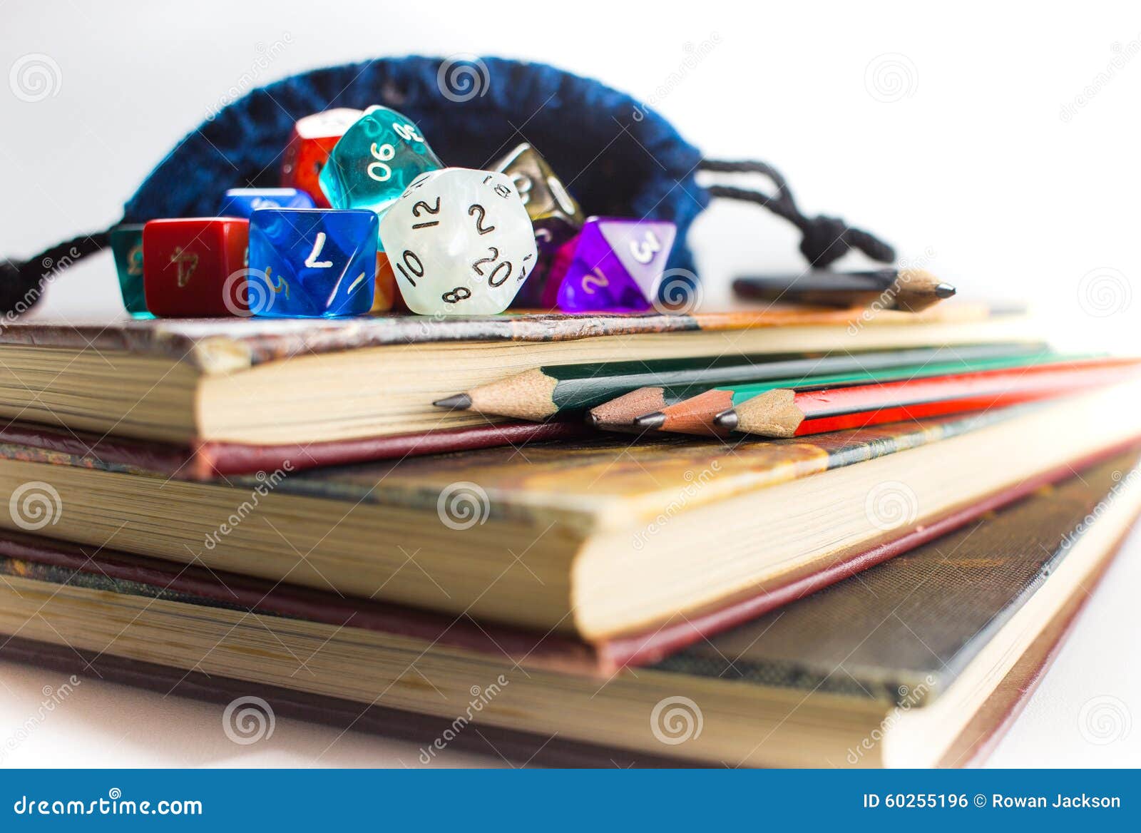 Close Up of Dice and Pencils on Top of Books Stock Photo - Image of ...