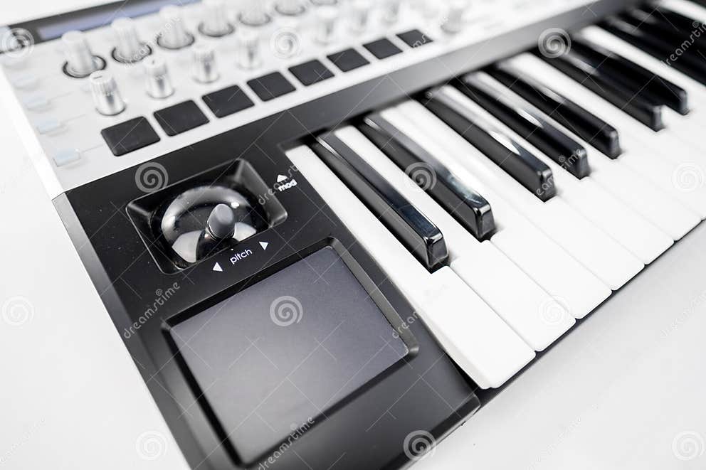 Close-Up of a Digital MIDI Keyboard Controller Featuring White Keys and ...