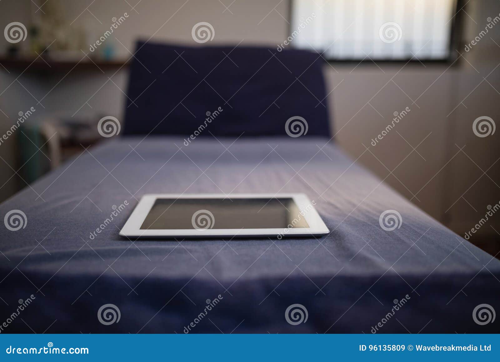 Close-up of Digital Tablet on Blue Bed Stock Image - Image of window ...