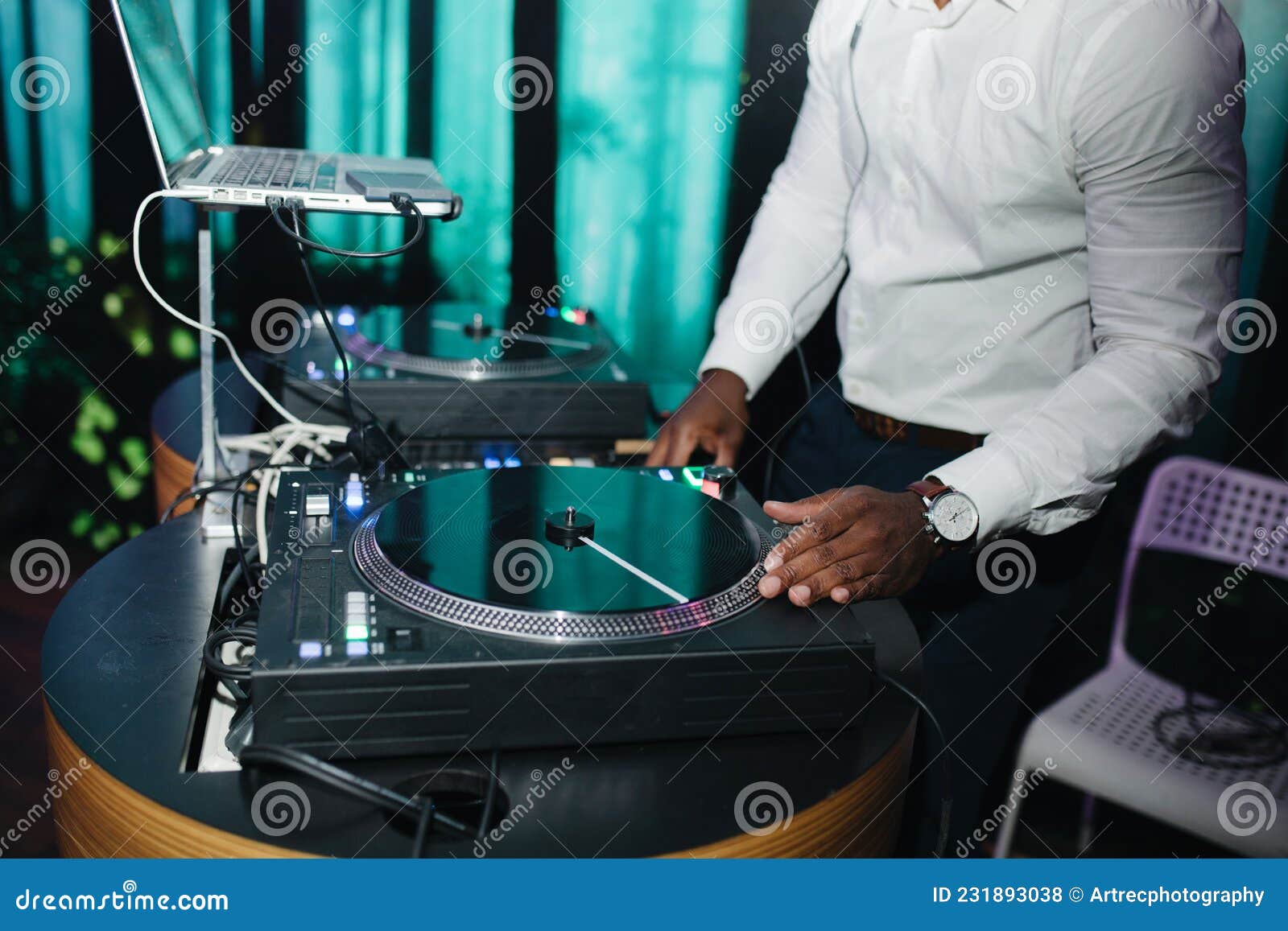 Close Up of DJ Console at the Party. Neon Lights Over the Hands of ...