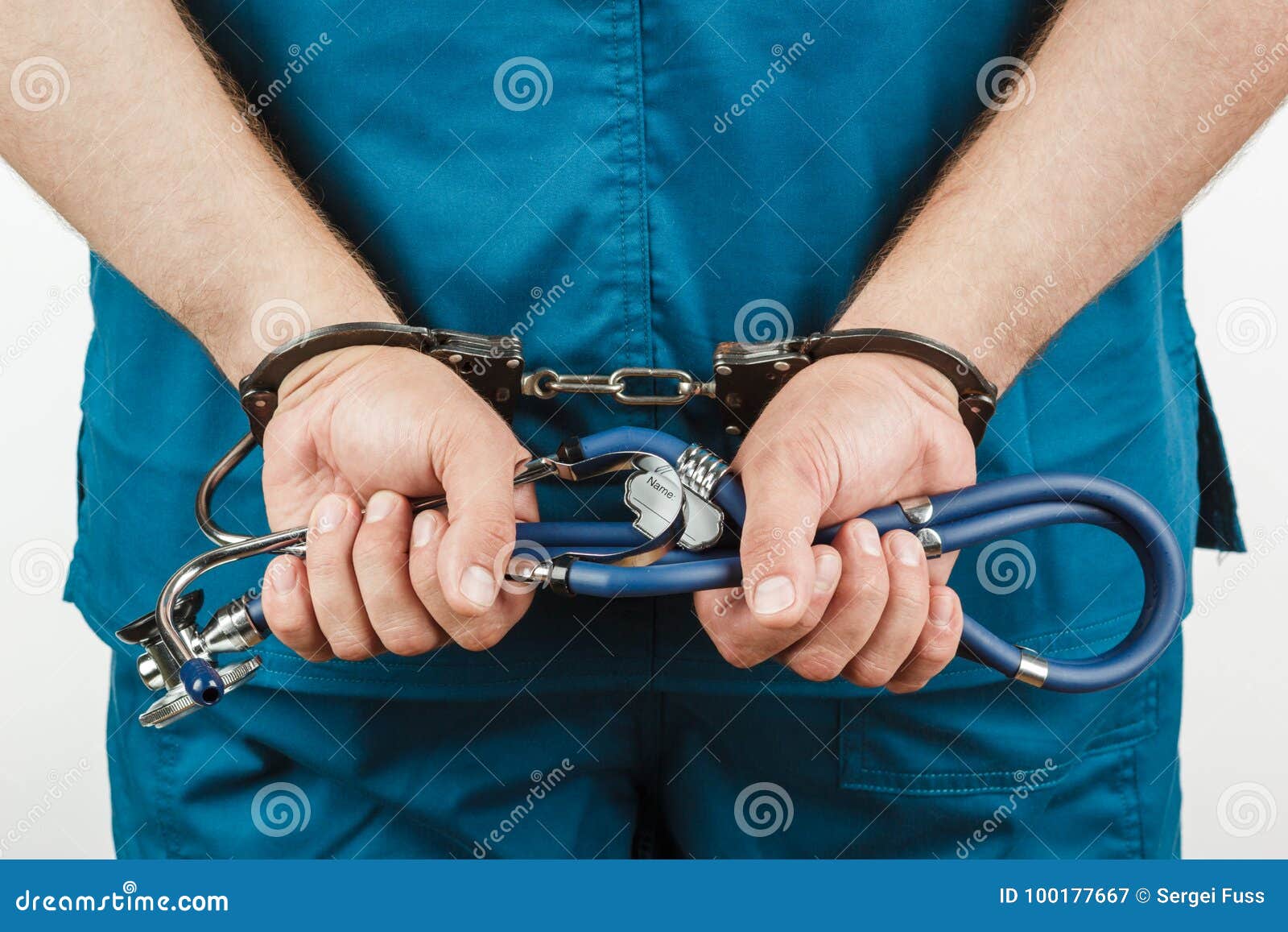 Close-up of Doctor Hands with Stethoscope in Handcuffs. Stock Image ...