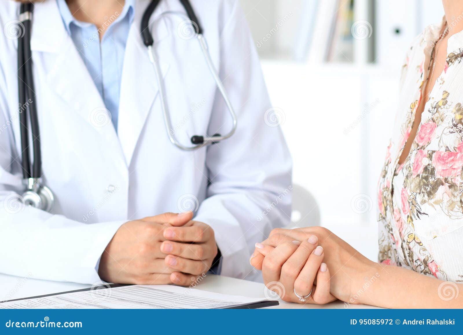 Close Up of a Doctor and Patient Sitting at the Table, Just Hands Stock ...