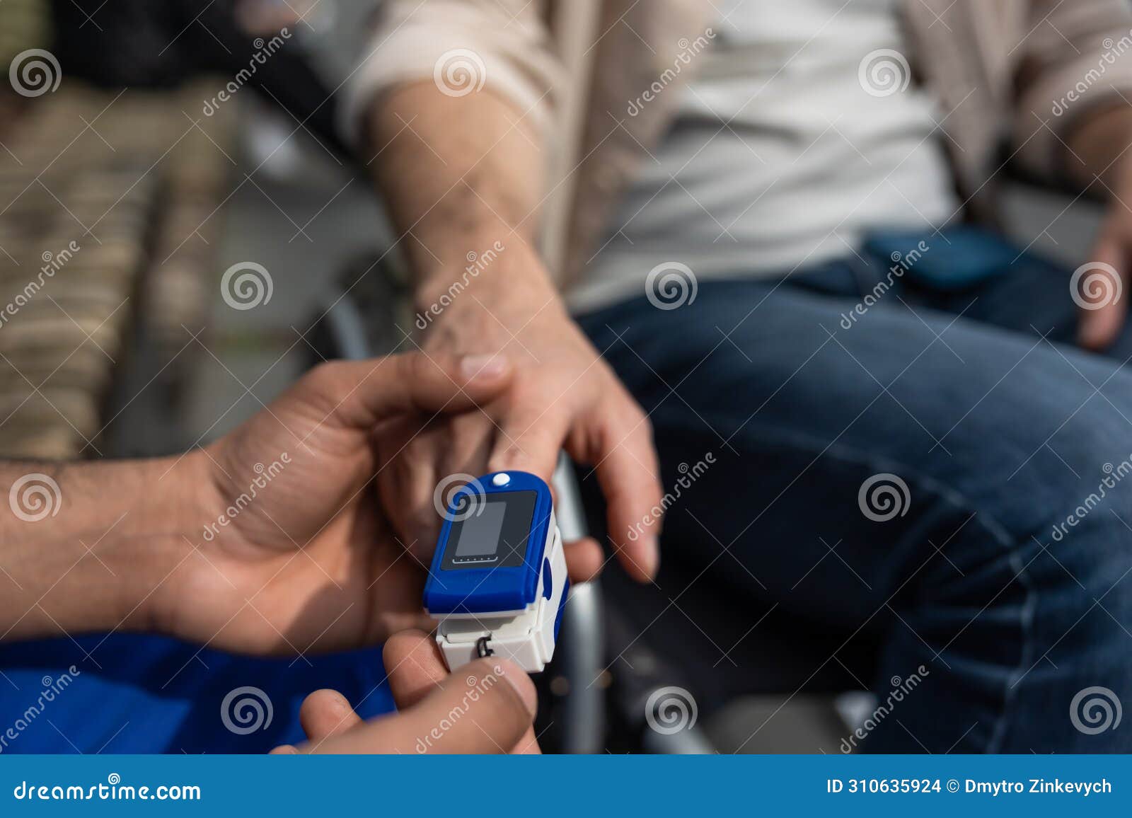 Close Up of Doctors Hands Measuring Patients Pulse with Pulsometer ...