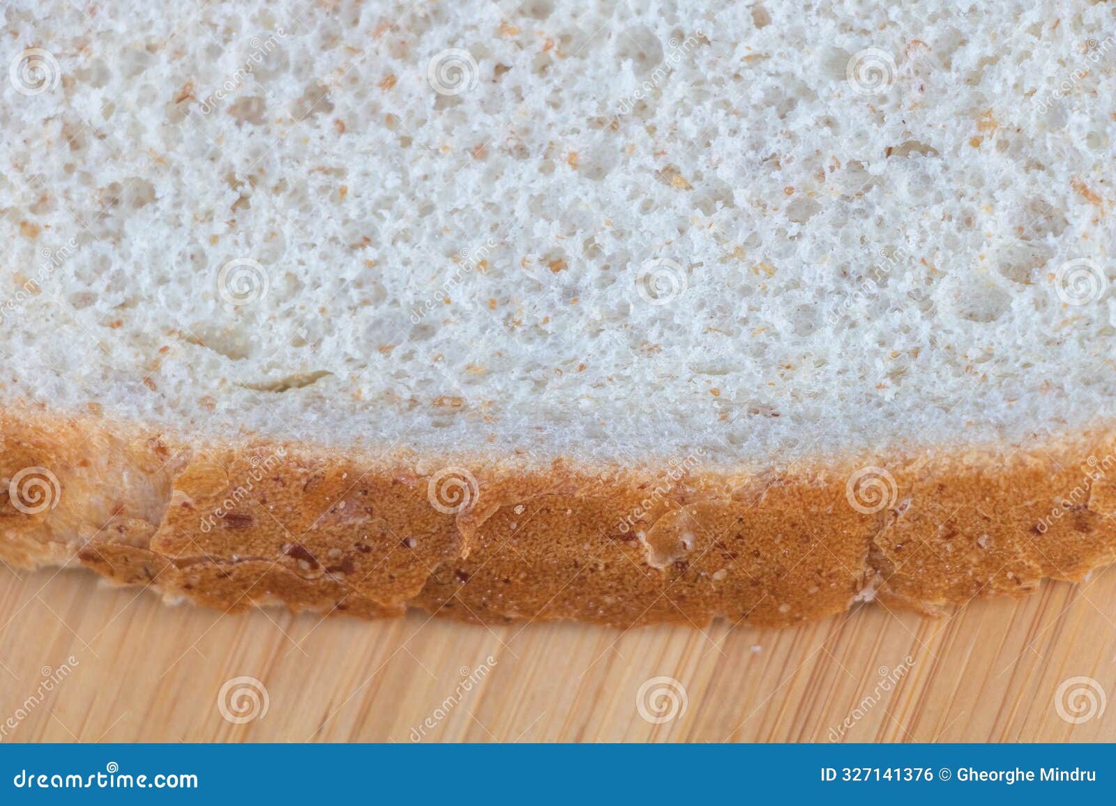 Close-up of the Edge and Texture of White Bread Slice on Wooden Table ...