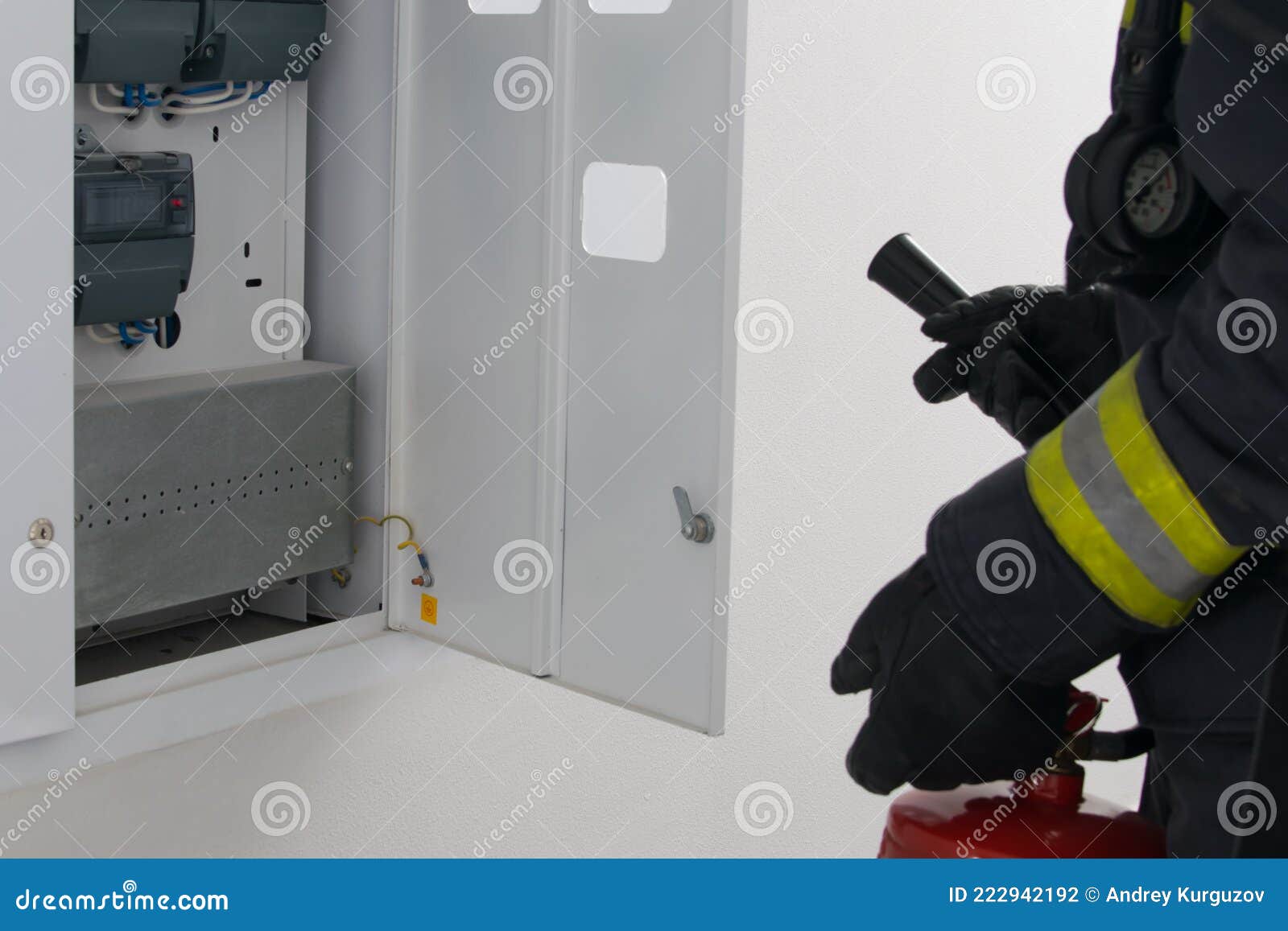 Close-up of an Electrical Switchboard, a Firefighter Holding a Fire ...