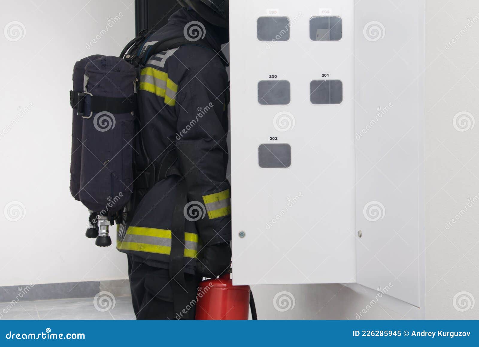 Close-up of an Electrical Switchboard, a Firefighter Holding a Fire ...