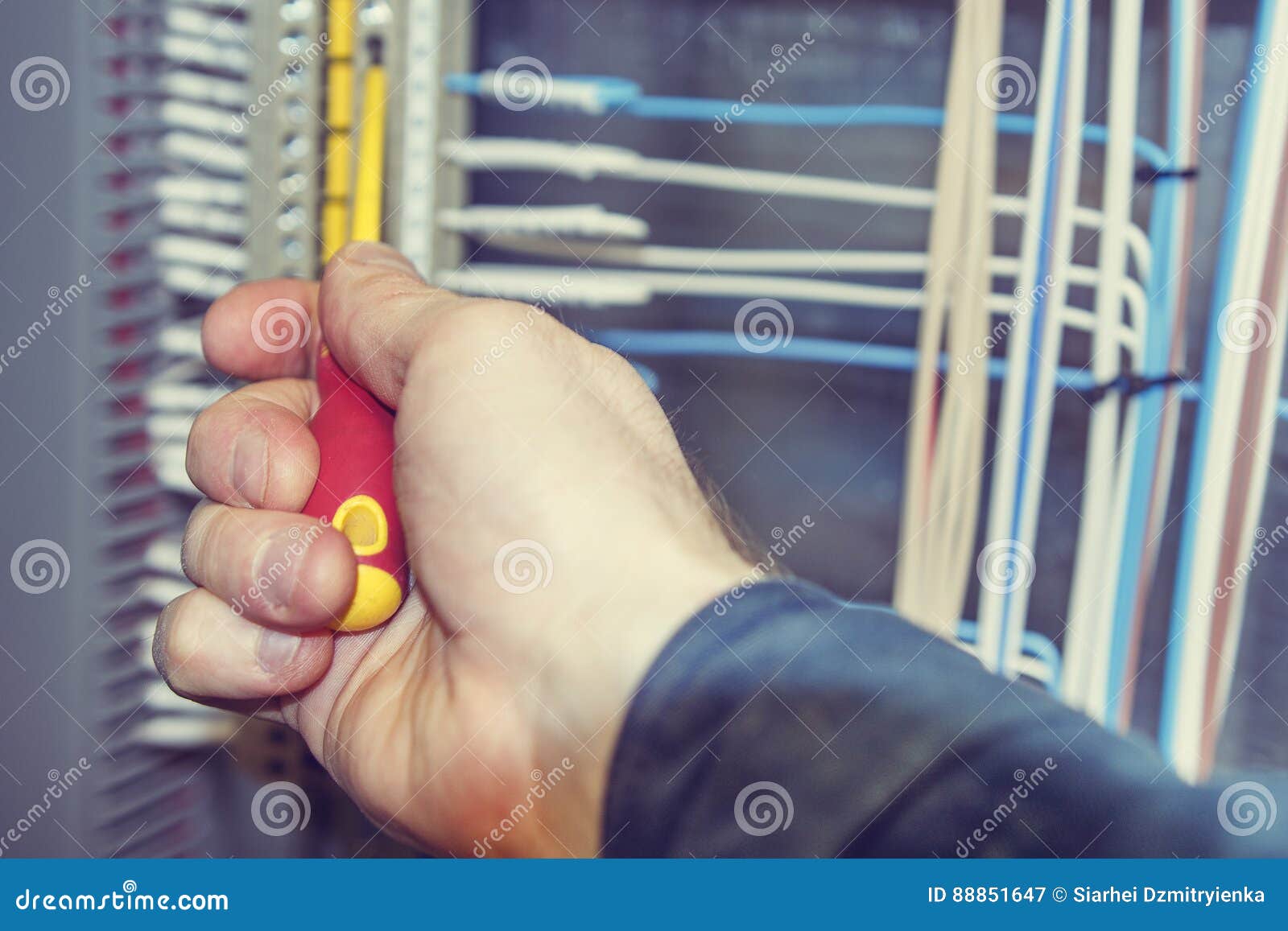 A Close-up Electrician Hand Performs Electrical Work. Stock Image ...