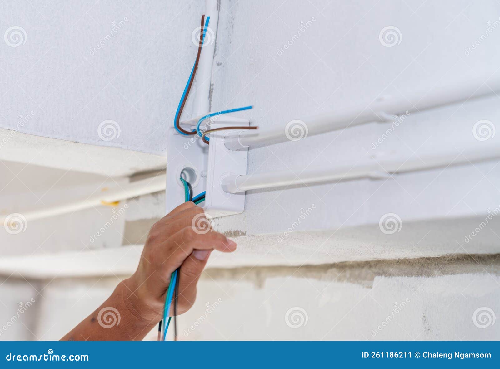 Close Up Electrician Hand Pulling Wire into PVC Conduit Stock Image ...